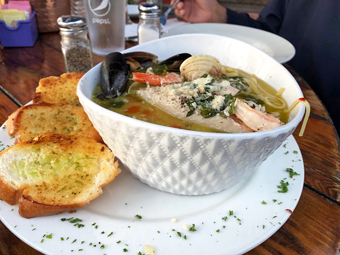 Seafood linguini that makes you wonder if mermaids moonlight as chefs. Those little neck clams aren't just ingredients—they're ocean ambassadors.