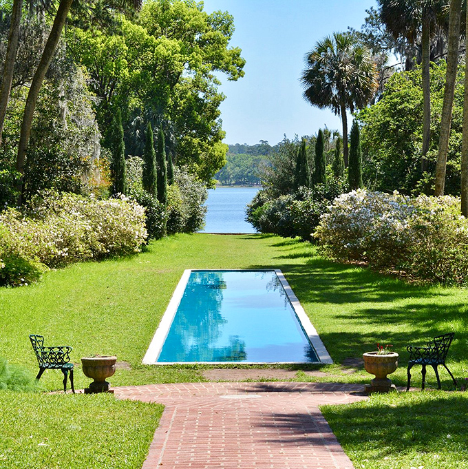 The reflecting pool creates perfect symmetry between sky and garden. Monet would've canceled his water lily project if he'd seen this.