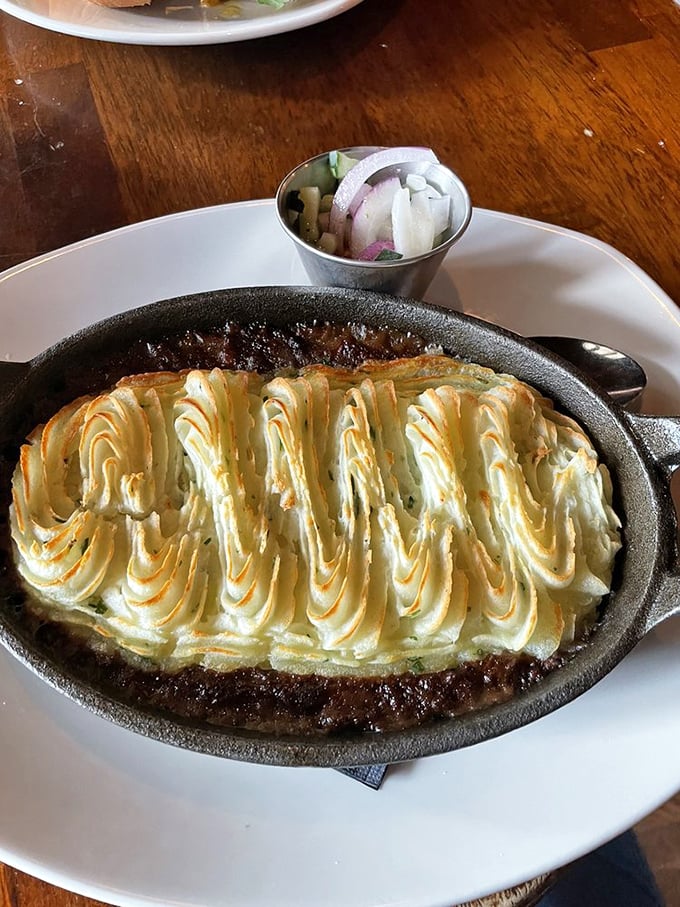 Behold the star attraction &ndash; shepherd's pie with its golden potato peaks hiding a savory treasure of meat and vegetables below.