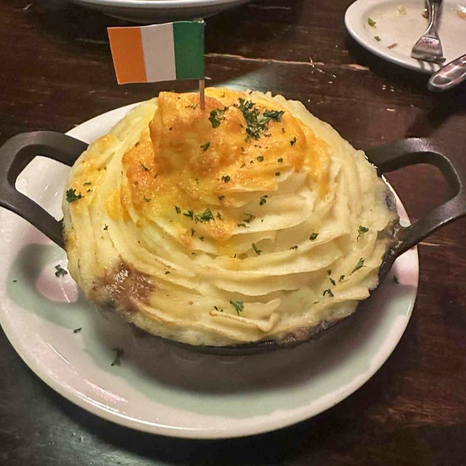 Behold the shepherd's pie in all its golden-topped glory! That Irish flag isn't just decoration—it's claiming this dish as a national treasure worth crossing oceans for.