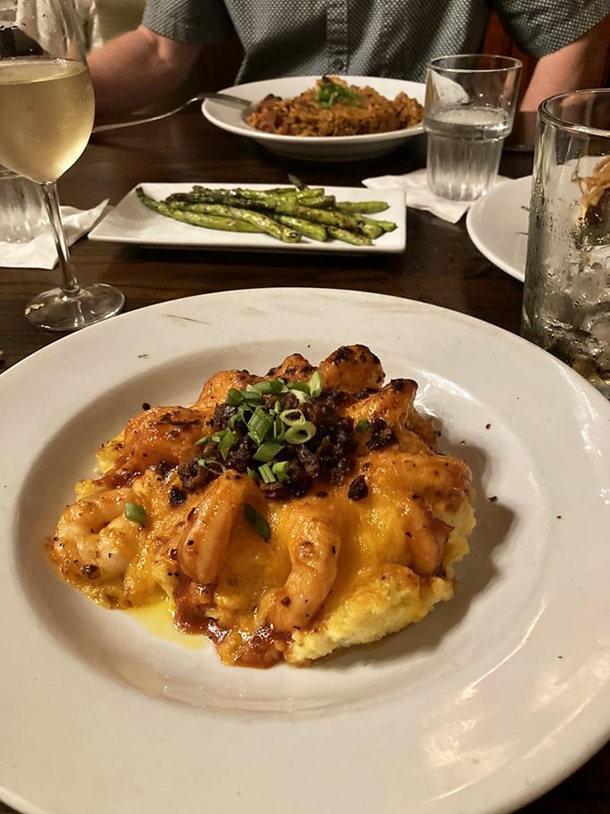Behold the holy grail of Lowcountry cuisine! Plump shrimp nestled atop creamy grits with bacon and green onions&mdash;comfort food that's dressed for the opera.