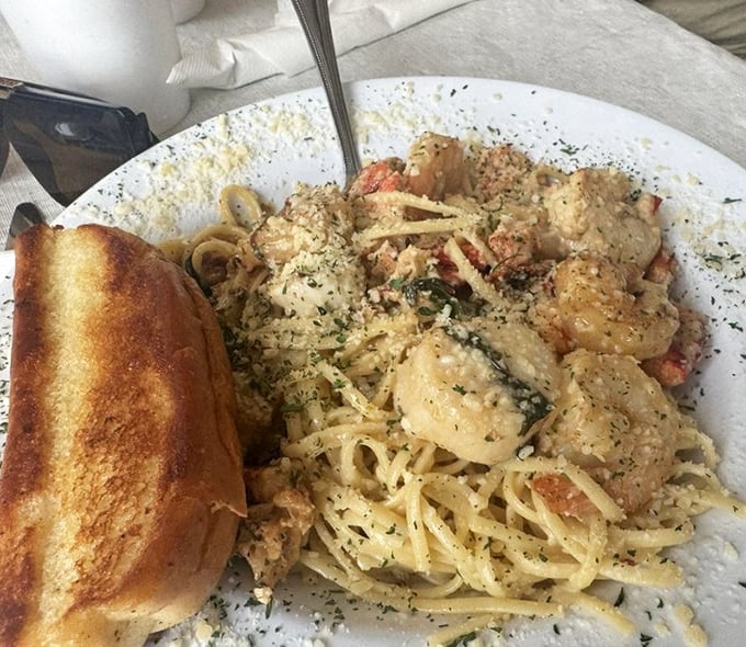 Pasta perfection meets seafood symphony. This shrimp and scallop scampi doesn't just satisfy hunger—it resolves existential crises about whether heaven might actually be on a plate.