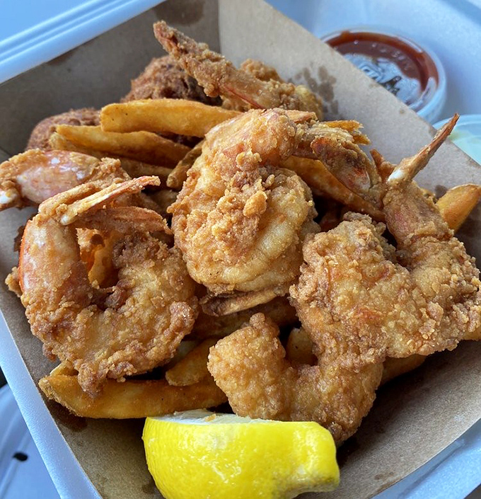 Golden-fried shrimp that look like they jumped straight from the ocean into the fryer, with a crispy coating that audibly crunches with each bite.