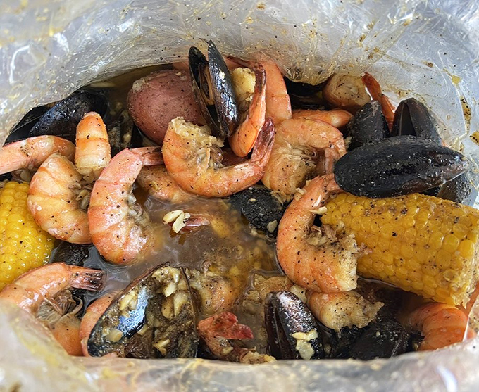 Seafood boils arrive in clear bags, sealing in all those aromatic spices. It's like Christmas morning, but with shrimp and mussels.