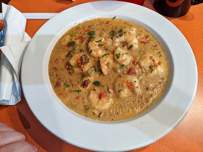This isn't just shrimp and grits; it's a creamy Southern hug in a bowl, studded with plump shrimp and colorful peppers.