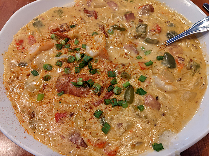 This isn't just shrimp and grits; it's a creamy, savory Southern symphony where each spoonful tells a story of coastal comfort.