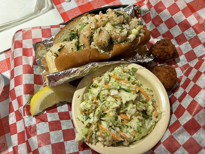 The shrimp roll arrives like a seafood celebrity, perfectly dressed and ready for its close-up with that crisp coleslaw sidekick.