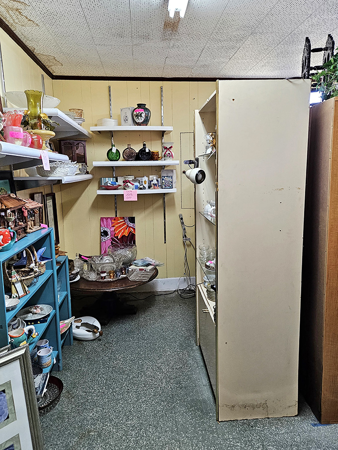 Narrow pathways lead to unexpected discoveries, like this cozy nook where vintage glassware catches the light just right.