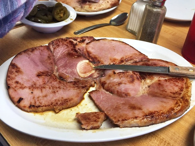 Country ham that's been kissed by smoke and fire until it reaches that perfect pink – this isn't just breakfast, it's edible artwork.