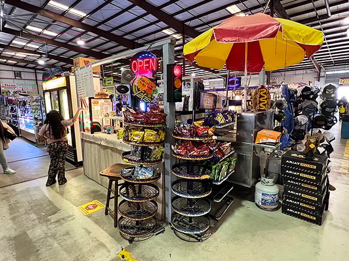 Snack heaven beckons with a carnival-colored umbrella and neon "OPEN" sign. Even the most disciplined bargain hunter needs fuel for the journey!