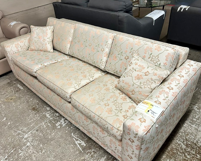 Floral patterns that somehow transcend decades. This sofa has seen things, but with those cushions, it's kept all its secrets perfectly comfortable.