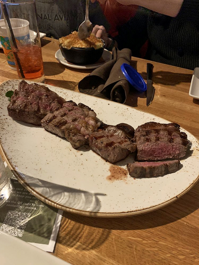 Behold the star of the show&mdash;perfectly seared steak sliced to showcase that rosy interior. This isn't dinner; it's performance art.