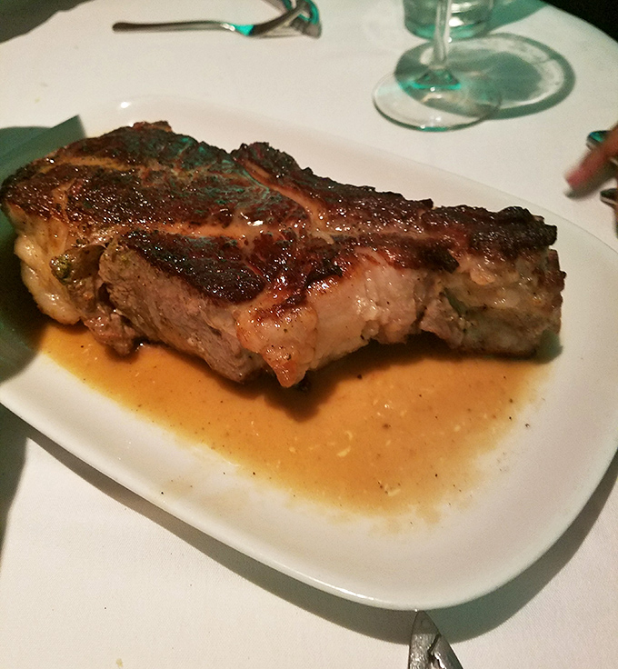 This isn't just a steak; it's a masterpiece of meat science&mdash;perfectly seared outside, gloriously juicy inside, and sitting in a pool of its own magnificent juices.