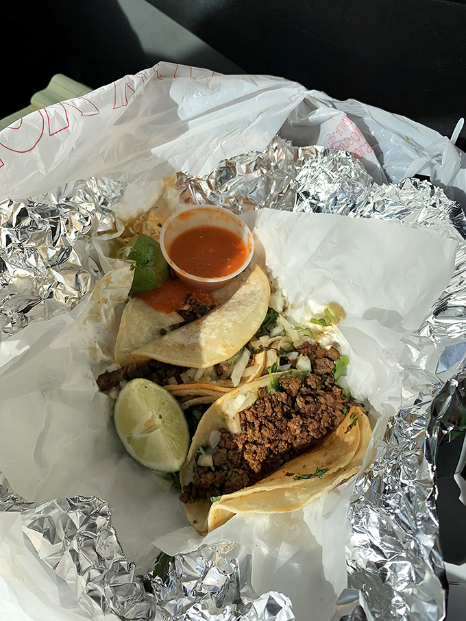 These tacos aren't playing around. Seasoned meat, fresh toppings, and that little lime wedge that makes everything sing. Perfection in simplicity.