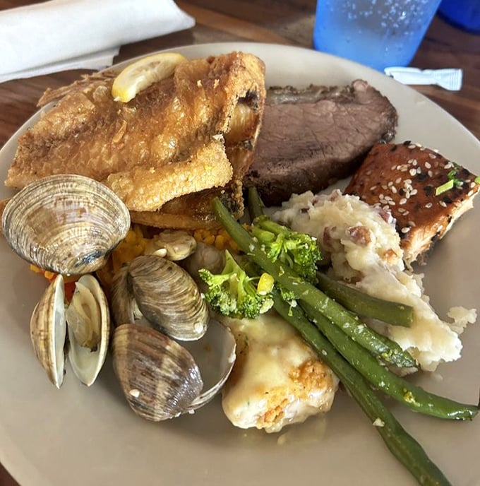 A plate that tells the whole story &ndash; surf meets turf in a delicious summit where clams, fish, and prime rib negotiate peaceful coexistence.