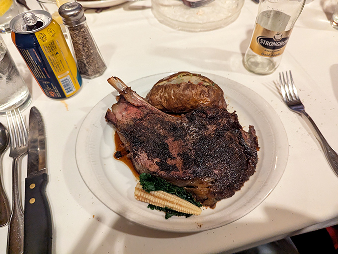 This bone-in masterpiece isn't just dinner; it's a primal experience with a side of spinach for your conscience.