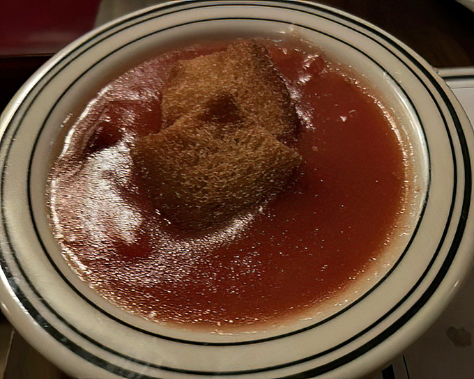 These stewed tomatoes aren't just a side dish; they're a religious experience that's converted more vegetable skeptics than a wellness influencer.