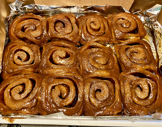 Behold: the reason people set alarms before sunrise. These aren't just sticky buns; they're edible evidence that someone, somewhere, loves you.