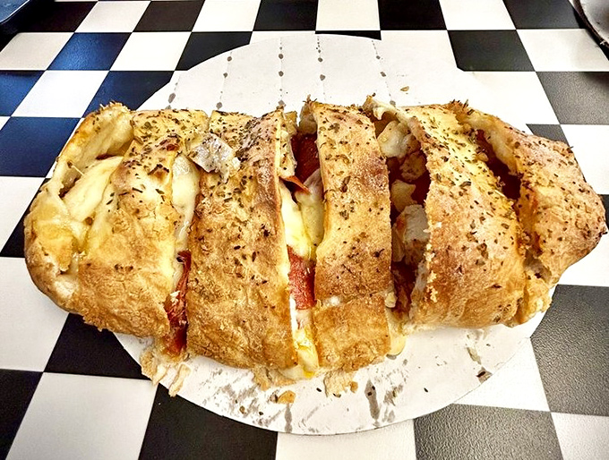 Behold the Stromboli in all its golden-crusted glory&mdash;a magnificent package of melted cheese and savory fillings that demands your immediate attention.