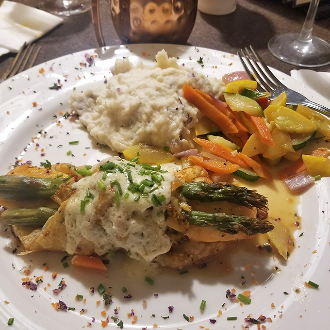 Seafood that doesn't just swim to your plate but arrives with a full entourage of colorful vegetables and creamy accompaniments.