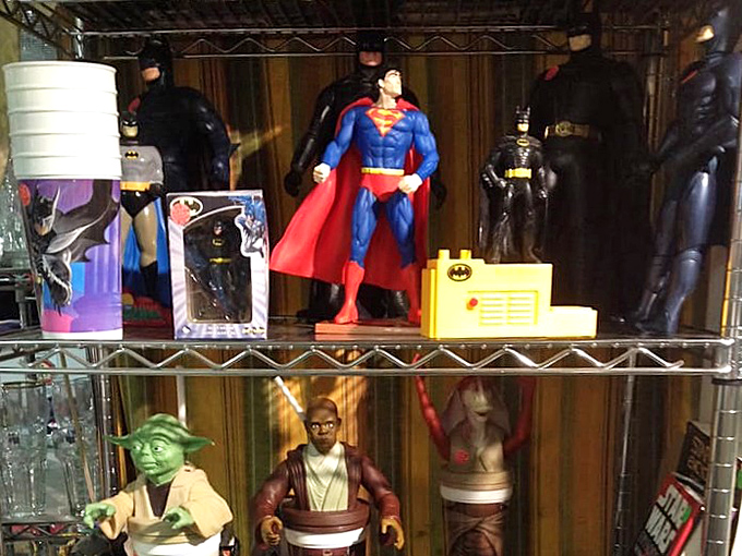 Holy collectibles, Batman! Superhero figures stand guard over childhoods past, waiting for new homes where they'll be appreciated for their heroic value.