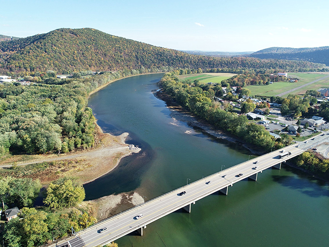 The Susquehanna River curves gracefully through the landscape, nature's own masterpiece that's been sculpting this valley since before postcards were invented.