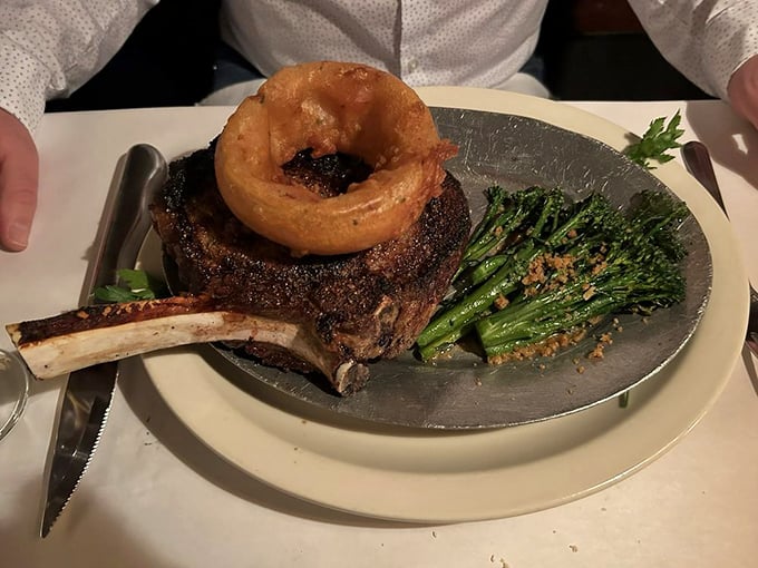 Behold the ribeye in all its glory! Crowned with a golden onion ring and flanked by vibrant broccolini, this is what meat dreams are made of.