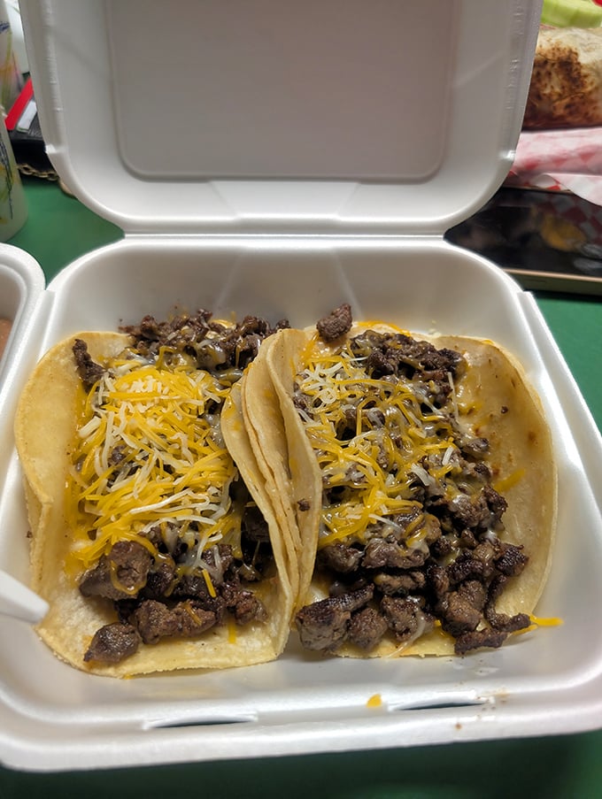 These aren't just tacos&mdash;they're tiny flavor festivals wrapped in corn tortillas, topped with melty cheese that stretches like your waistband will.