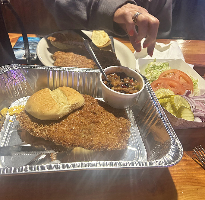 Behold the legendary tenderloin&mdash;a golden-brown masterpiece that laughs at the concept of fitting on a bun. Worth every delicious calorie.