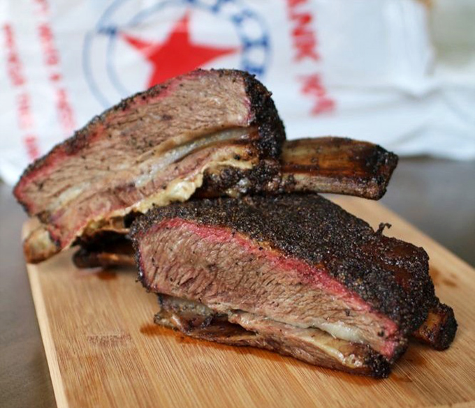 These beef ribs aren't just dinner; they're a primal experience that makes vegetarians question their life choices.