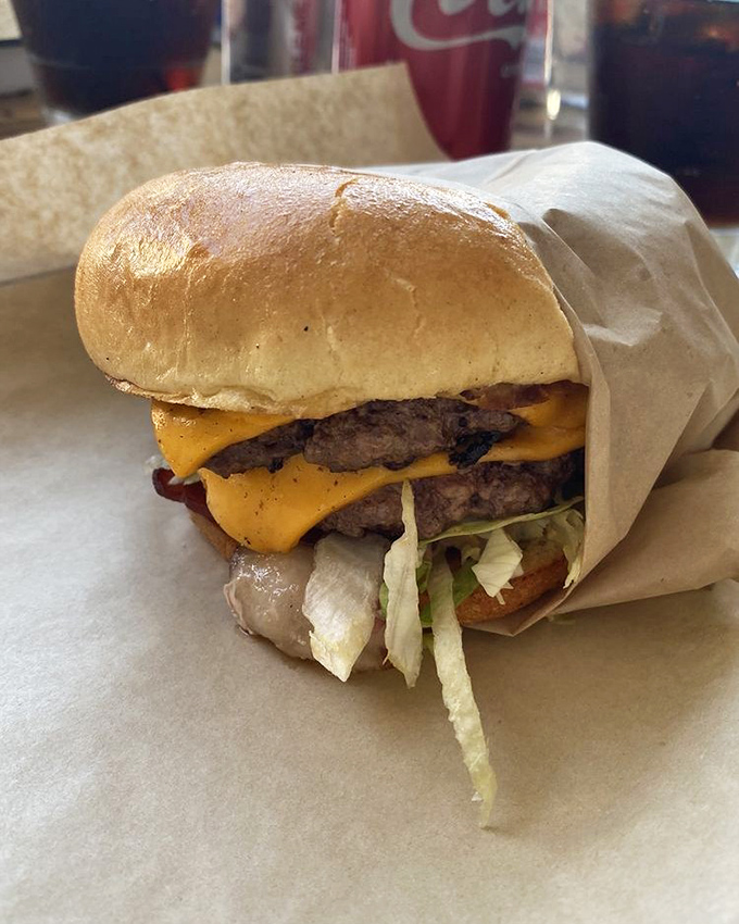 The American burger doesn't need a passport to impress. Two patties, cheese melting like California sunshine, and fresh toppings create burger nirvana.