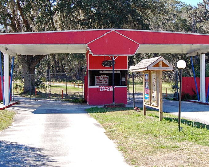 The ticket booth stands like a cheerful sentinel, its red awning promising admission to an experience that Netflix can't replicate, no matter how smart your TV.