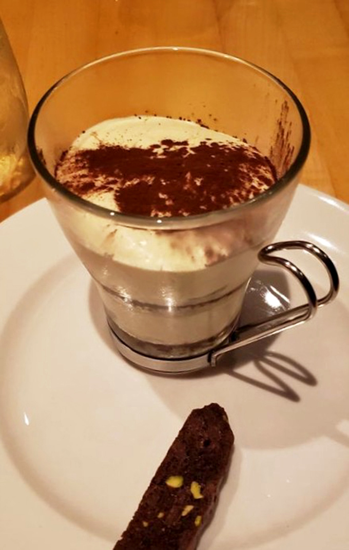 The legendary tiramisu arrives in a glass showcase, layers of coffee-soaked heaven and cloud-like mascarpone that might just ruin all other desserts for you.