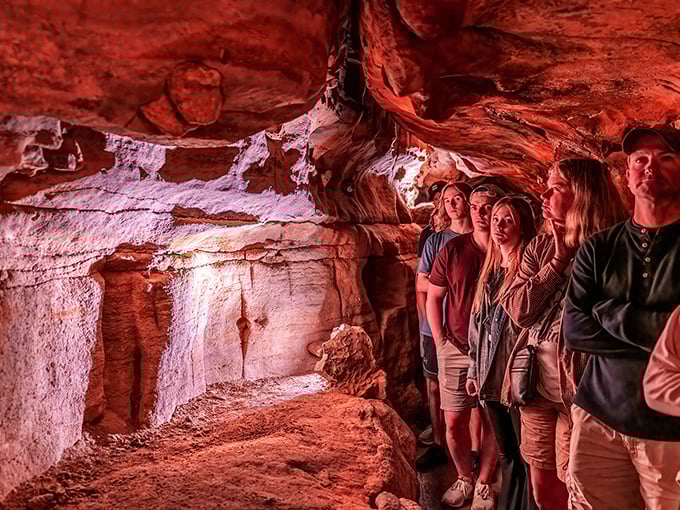 Wide-eyed explorers taking in nature's underground masterpiece. That magical moment when you realize you're walking through millions of years of history.