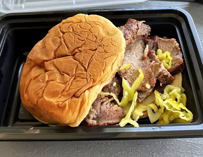 This tri-tip sandwich isn't just lunch; it's a masterclass in smoke, spice, and everything nice, with banana peppers adding just the right zing.