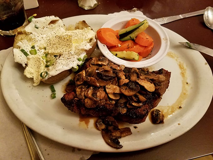 This tri-tip steak topped with saut&eacute;ed mushrooms isn't just dinner &ndash; it's what food dreams are made of. The loaded potato stands guard.