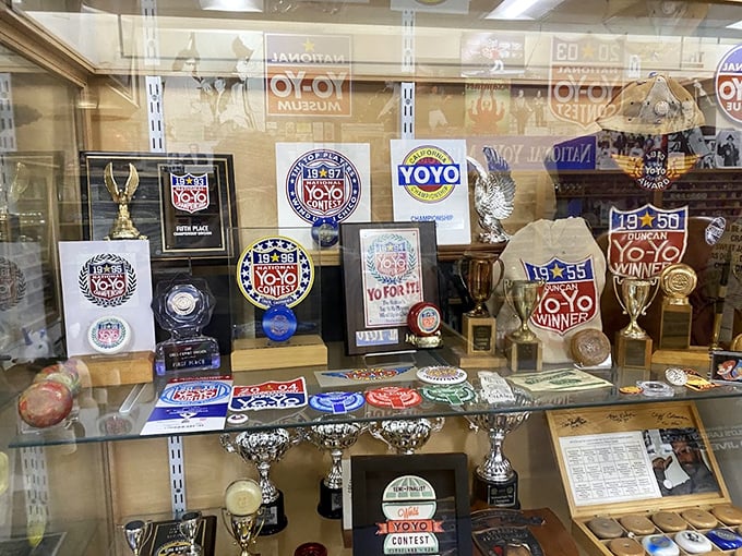 Trophy case of spinning dreams! Contest memorabilia showcases the competitive side of yo-yoing that most of us never knew existed.