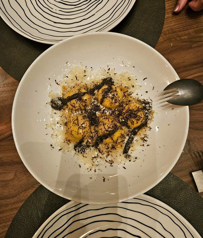 This truffle ravioli doesn't just sit on the plate&mdash;it performs, with each bite delivering a symphony of earthy richness that lingers deliciously.