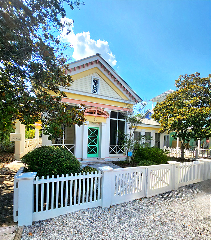 The yellow cottage with its perfect white picket fence isn't just charming—it's the architectural equivalent of a warm hug on a perfect Florida day.