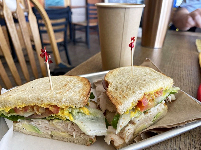 This isn't just a sandwich; it's architecture with avocado. Layers of turkey, veggies, and egg create a skyscraper of flavor that demands both hands and your full attention.