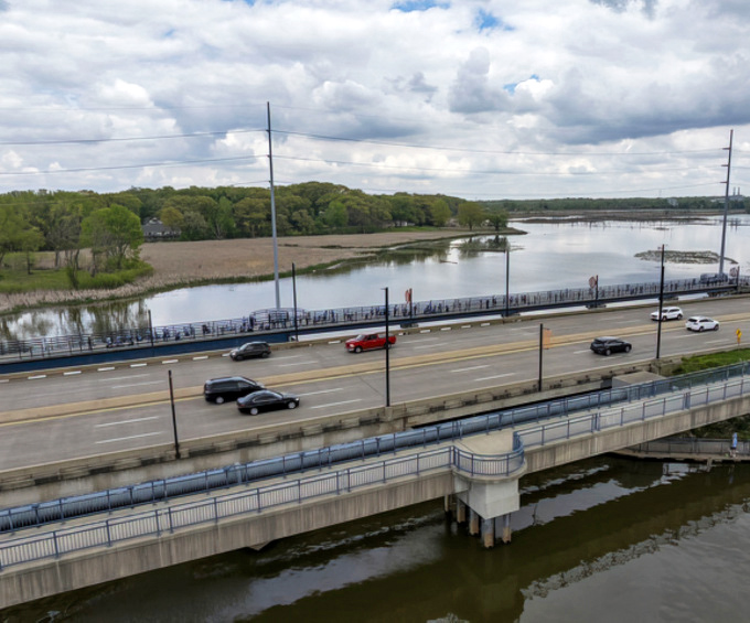 The Unity Bridge connects more than just shorelines—it's where locals gather for sunset strolls and visitors capture that perfect Michigan waterfront moment.