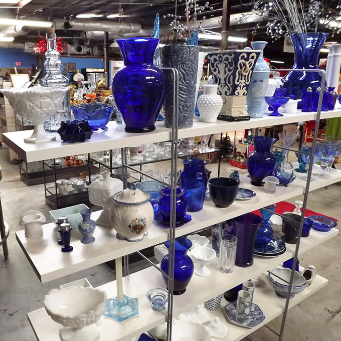 Cobalt blue vases stand like sapphires among pearls. One person's decluttered shelf becomes another's statement piece in this glassware galaxy.