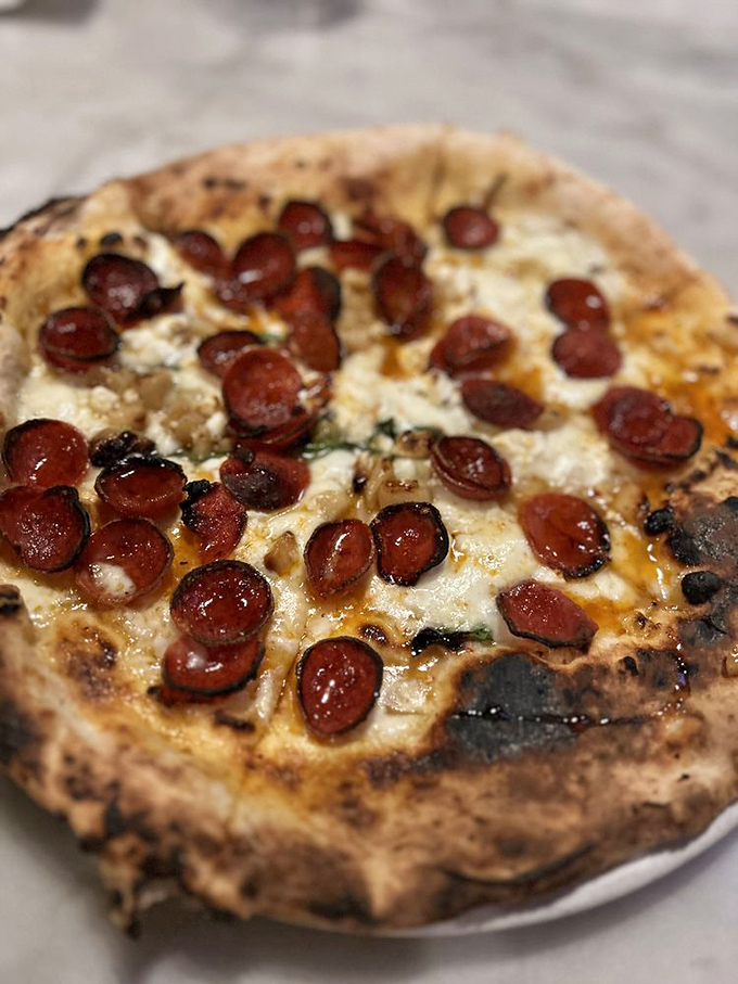 This Diavola pizza isn't just food &ndash; it's a religious experience. Those crispy-edged pepperoni discs are little flavor bombs of pure joy.