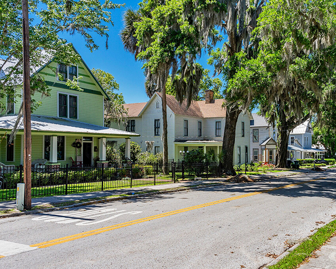 Pastel-colored Victorian homes line the street like a row of birthday cakes, each with its own personality and porch.