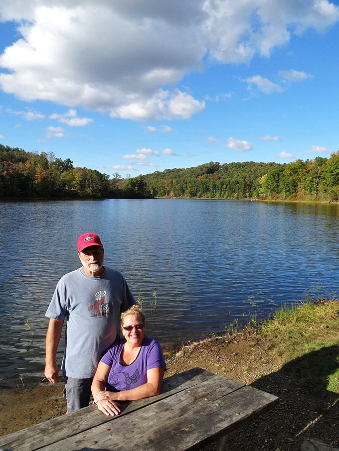 Visitors enjoying a peaceful moment by the lake, with the autumn colors creating a perfect backdrop for making lasting memories.