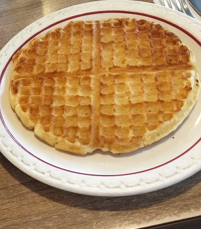 Golden waffle perfection with those signature grid indentations just waiting for butter to melt into every square. Maple syrup's perfect dance partner.