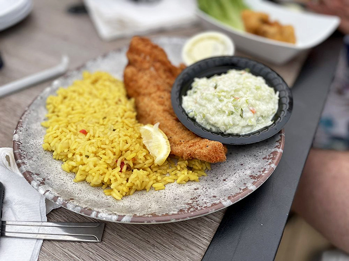 Golden walleye paired with vibrant rice showcases why locals consider this their hidden treasure.