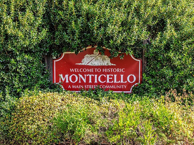 "Welcome to Historic Monticello"&mdash;where the sign is nestled in greenery as if to say, "Slow down, you're not in Disney anymore."