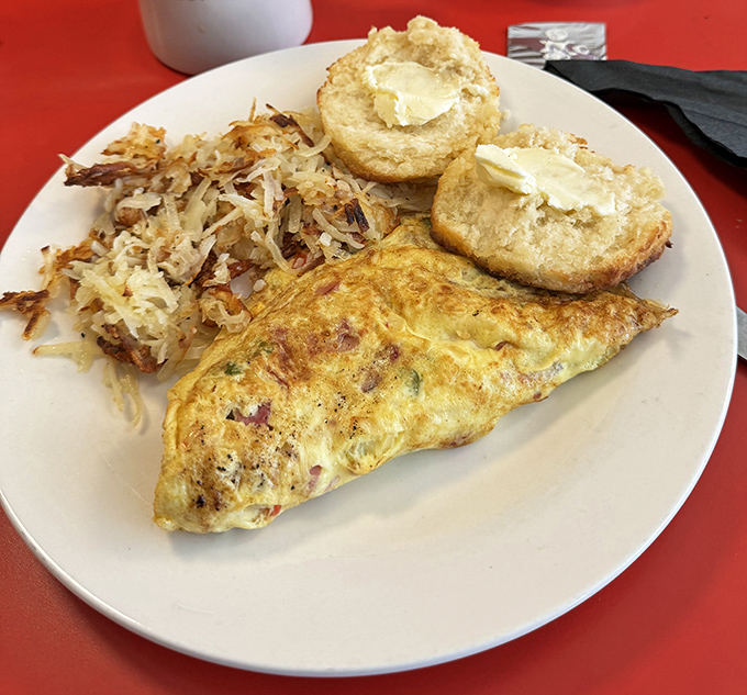 That Western omelette isn't just perfectly folded&mdash;it's a masterclass in egg architecture with hash browns that achieve the golden-crisp ideal.