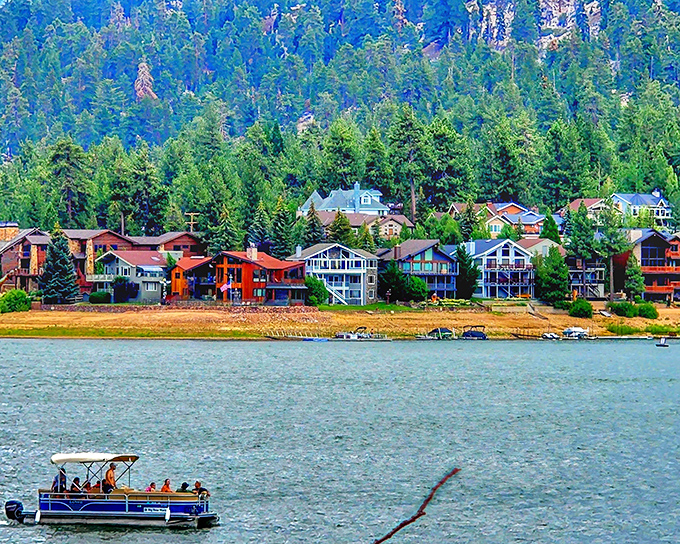 Colorful lakefront homes stand like a mountain rainbow against emerald pines, while pontoon boats drift lazily across Big Bear's sapphire waters.